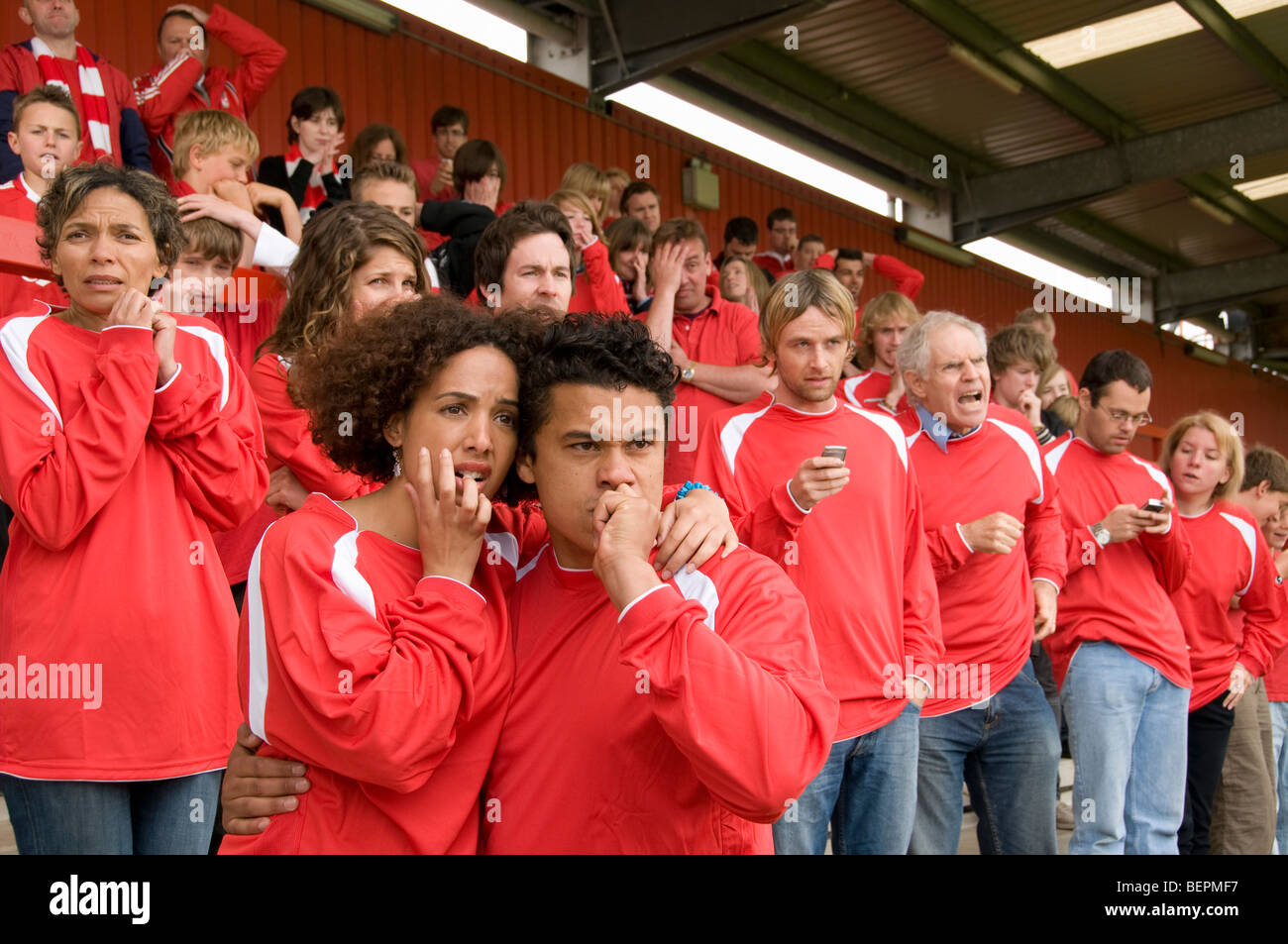 Nervous fans at football match Stock Photo - Alamy