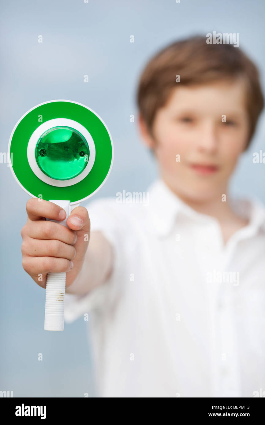 young boy holding up go sign Stock Photo - Alamy