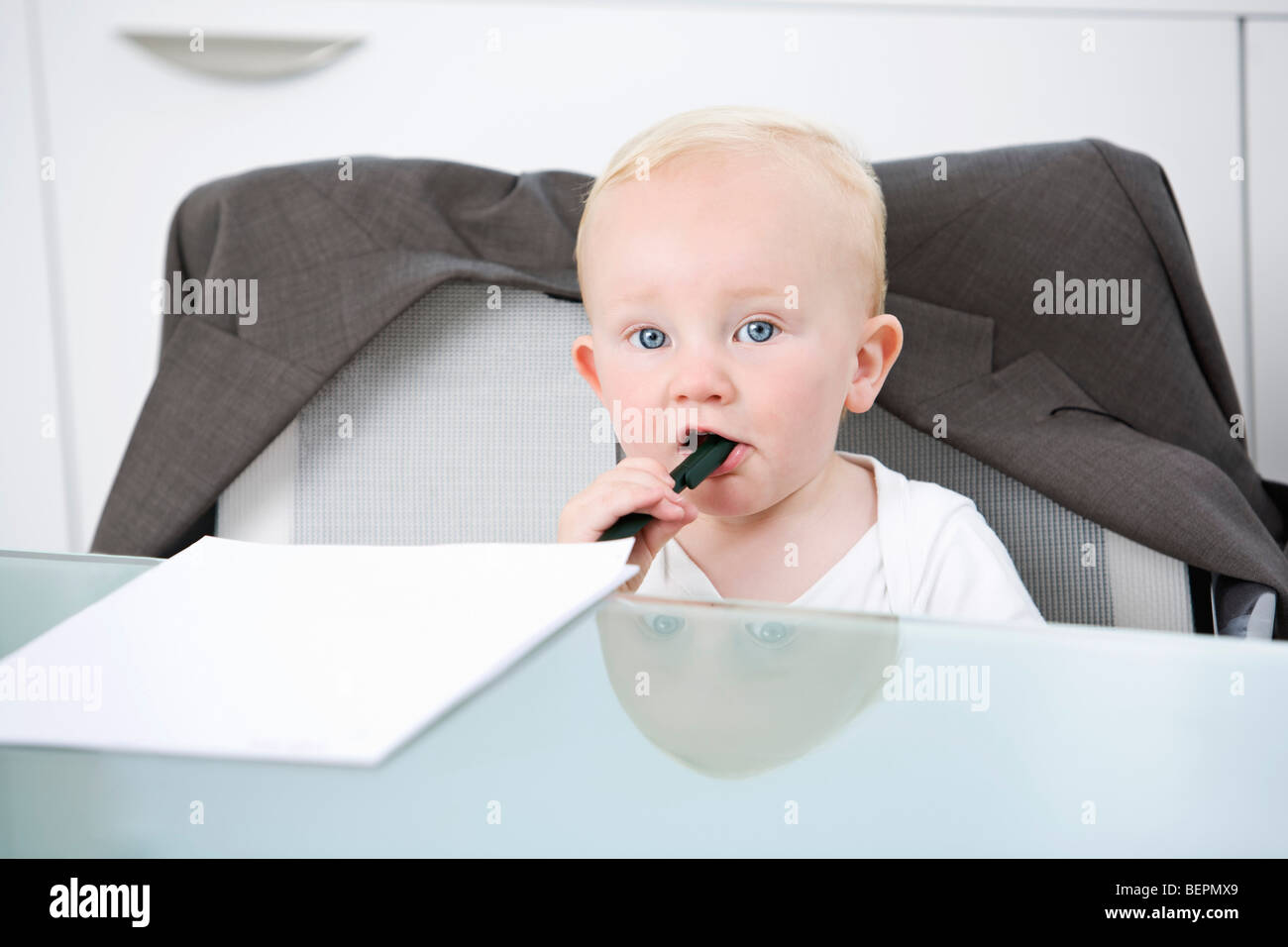 Portrait of a baby in an office chair Stock Photo - Alamy