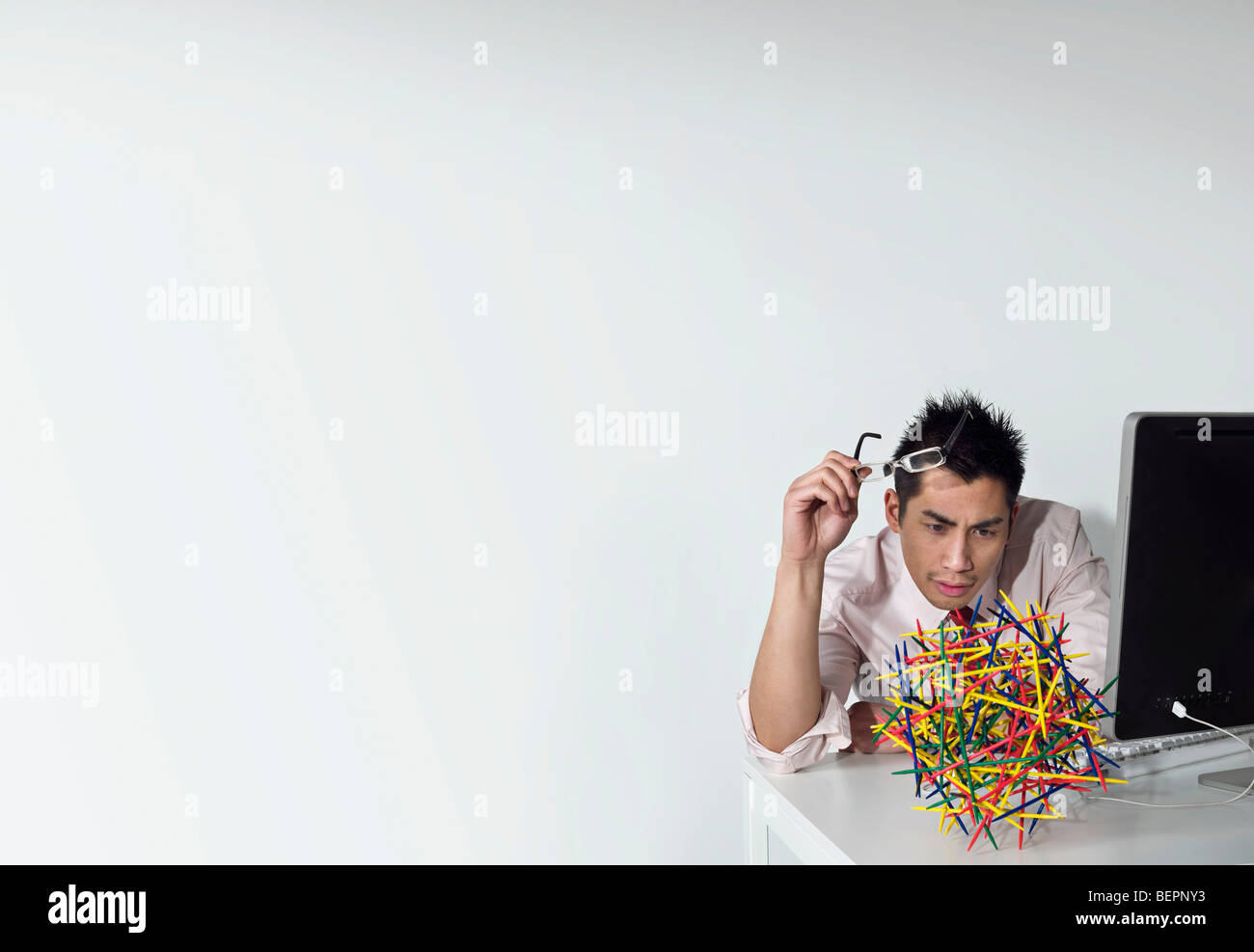 Business man looking at a sculpture Stock Photo - Alamy