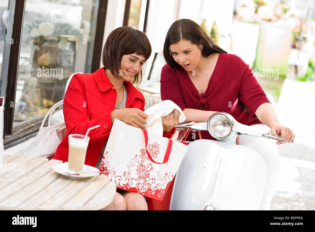 girlfriends meet in a street cafe Stock Photo - Alamy