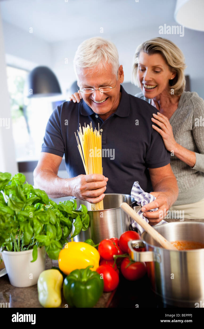 Senior Couple Preparing Spaghetti Stock Photo - Alamy