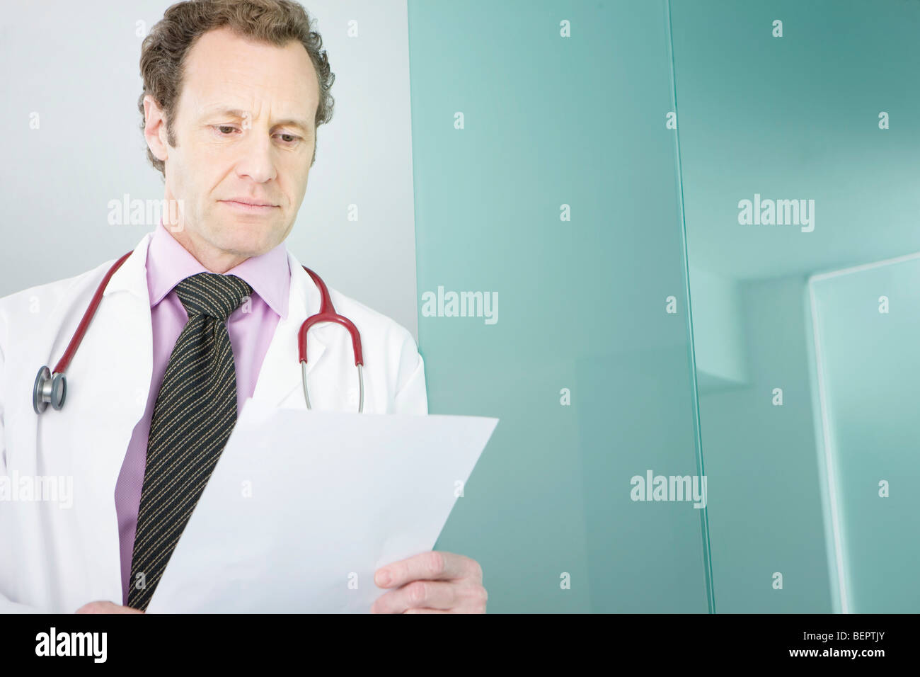 Doctor reading a letter hi-res stock photography and images - Alamy