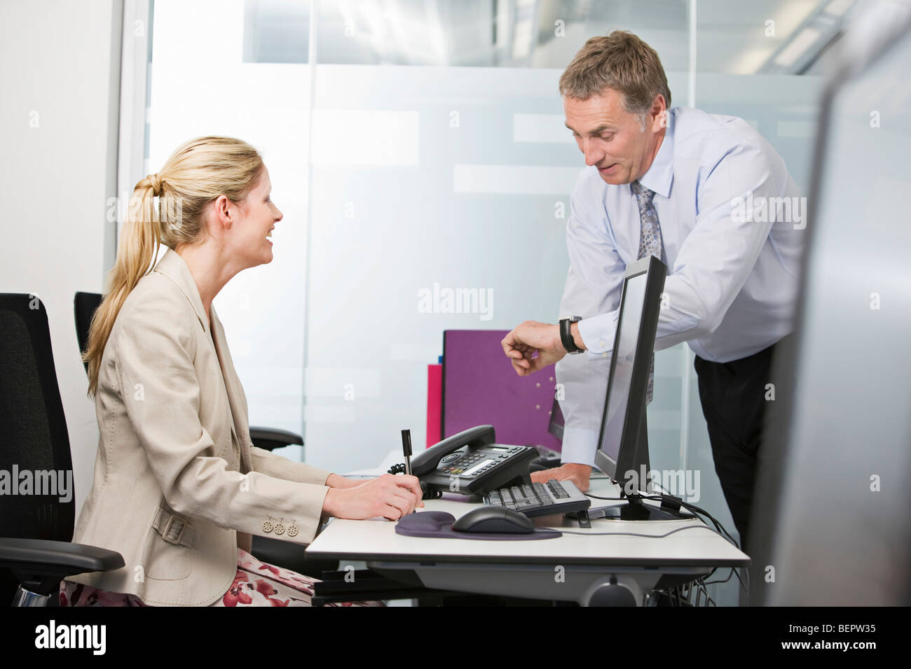 Couple discussing working together home hi-res stock photography and ...