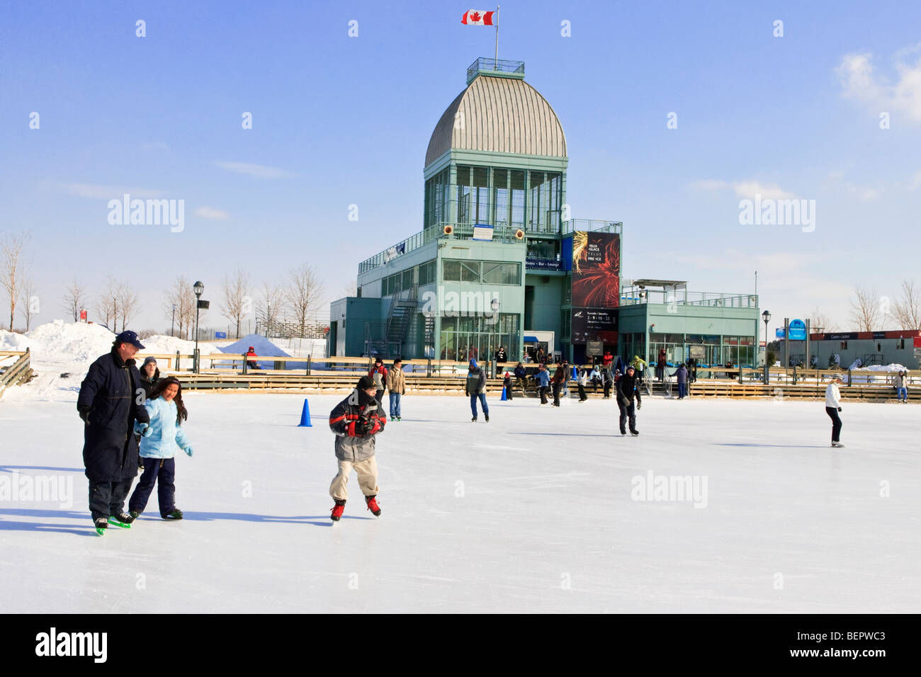 Outdoor ice skating during the day in the old port area of Montreal ...