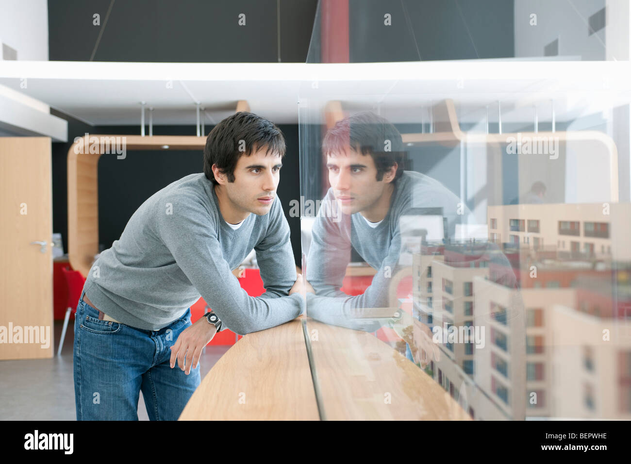 young man looking at construction model Stock Photo - Alamy