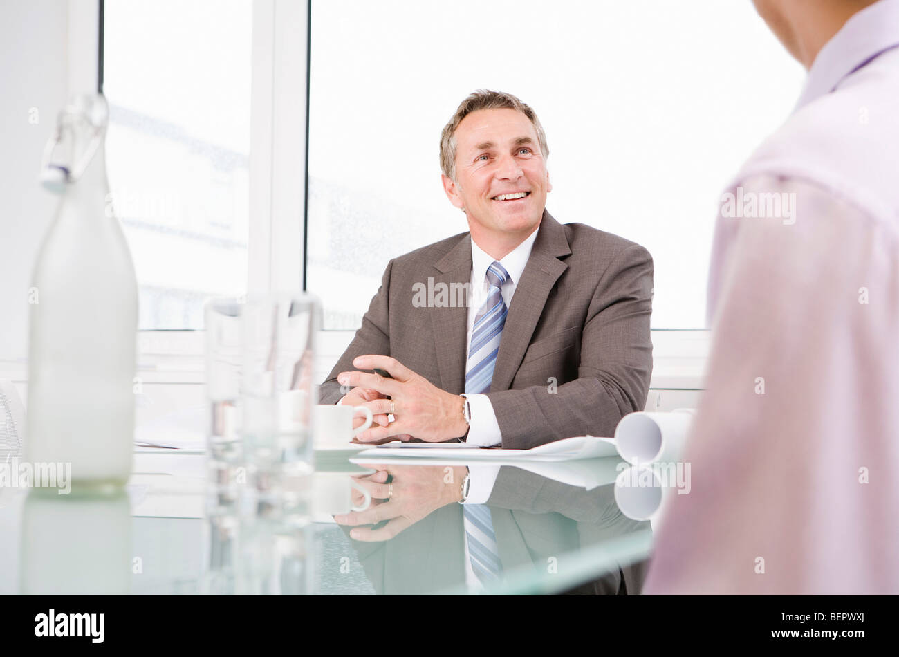 Authority hands clasped smiling sitting communication hi-res stock ...