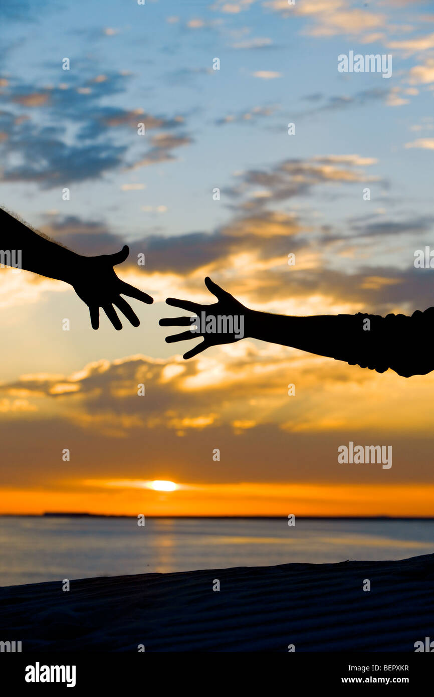 Hand reaching out or pulling away Stock Photo - Alamy