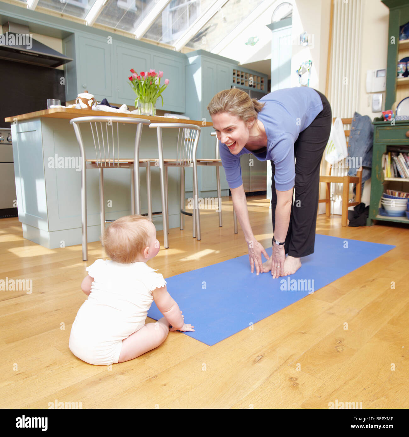 mum doing yoga with a baby Stock Photo - Alamy