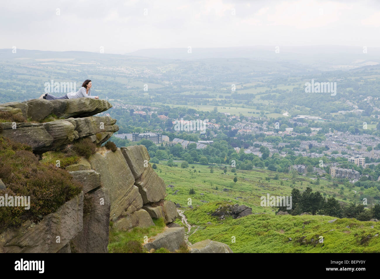 Woman lying down cliff hi-res stock photography and images - Alamy
