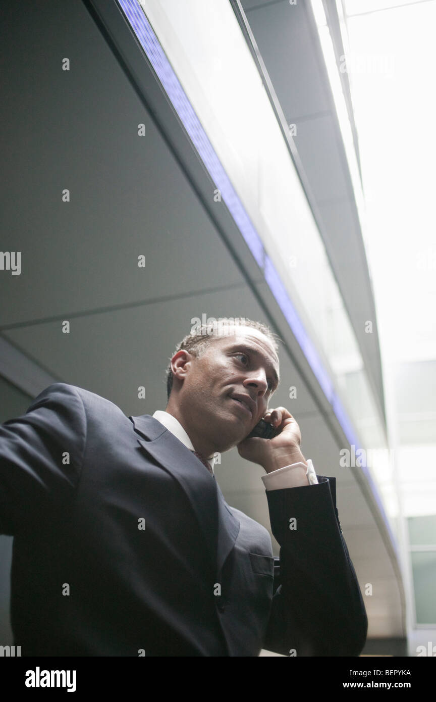 Man standing using cell hi-res stock photography and images - Alamy