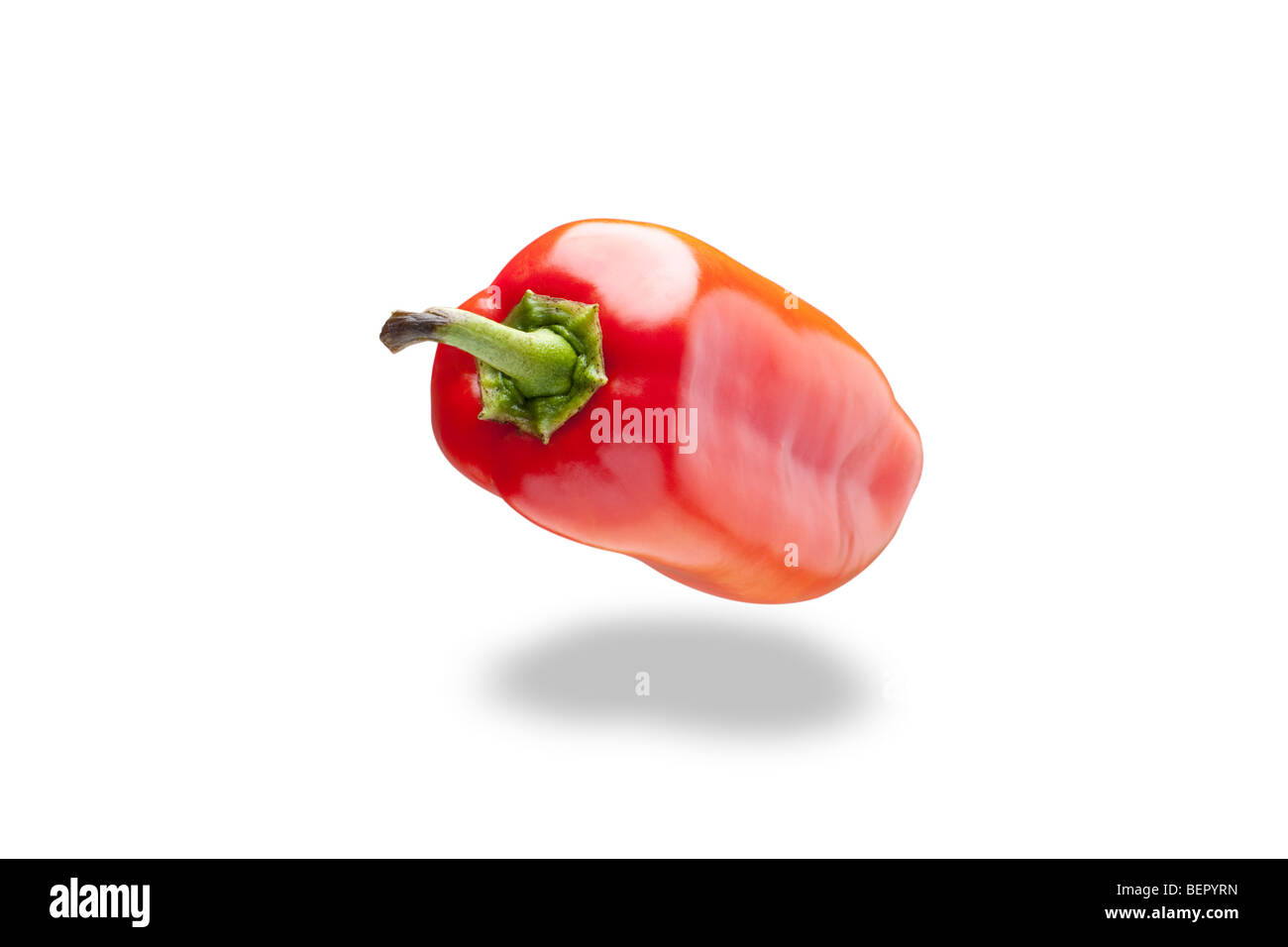 Floating clean red bell pepper on white background with nice shadow ...