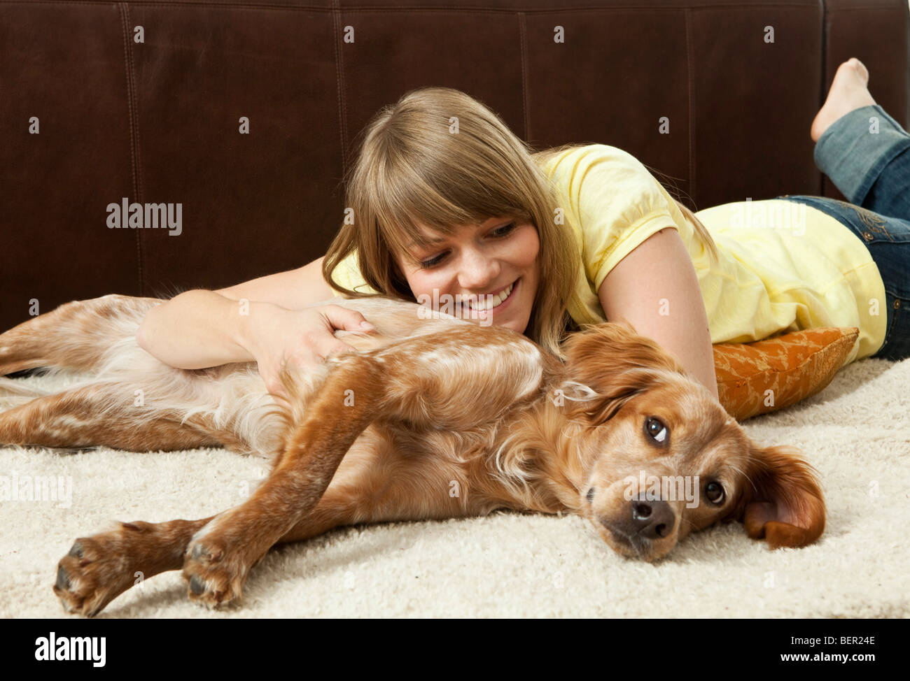 Young woman cuddling with her dog Stock Photo - Alamy