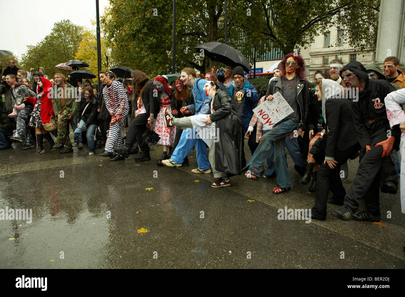 People dressed as Zombies talk along Oxford street London. Part of ...