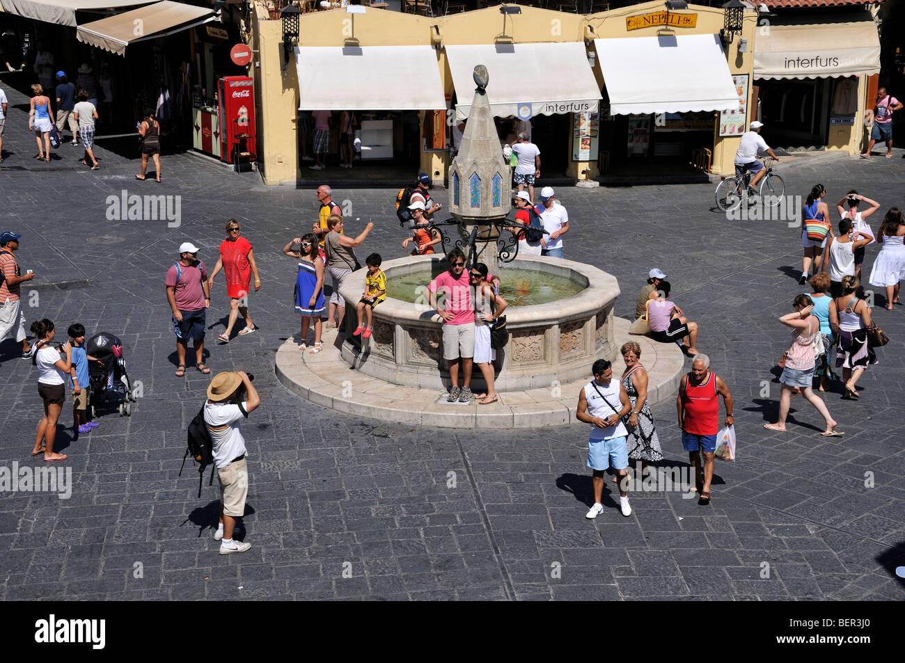 Old city of Rhodes, Greece, people walking and taking pictures at ...