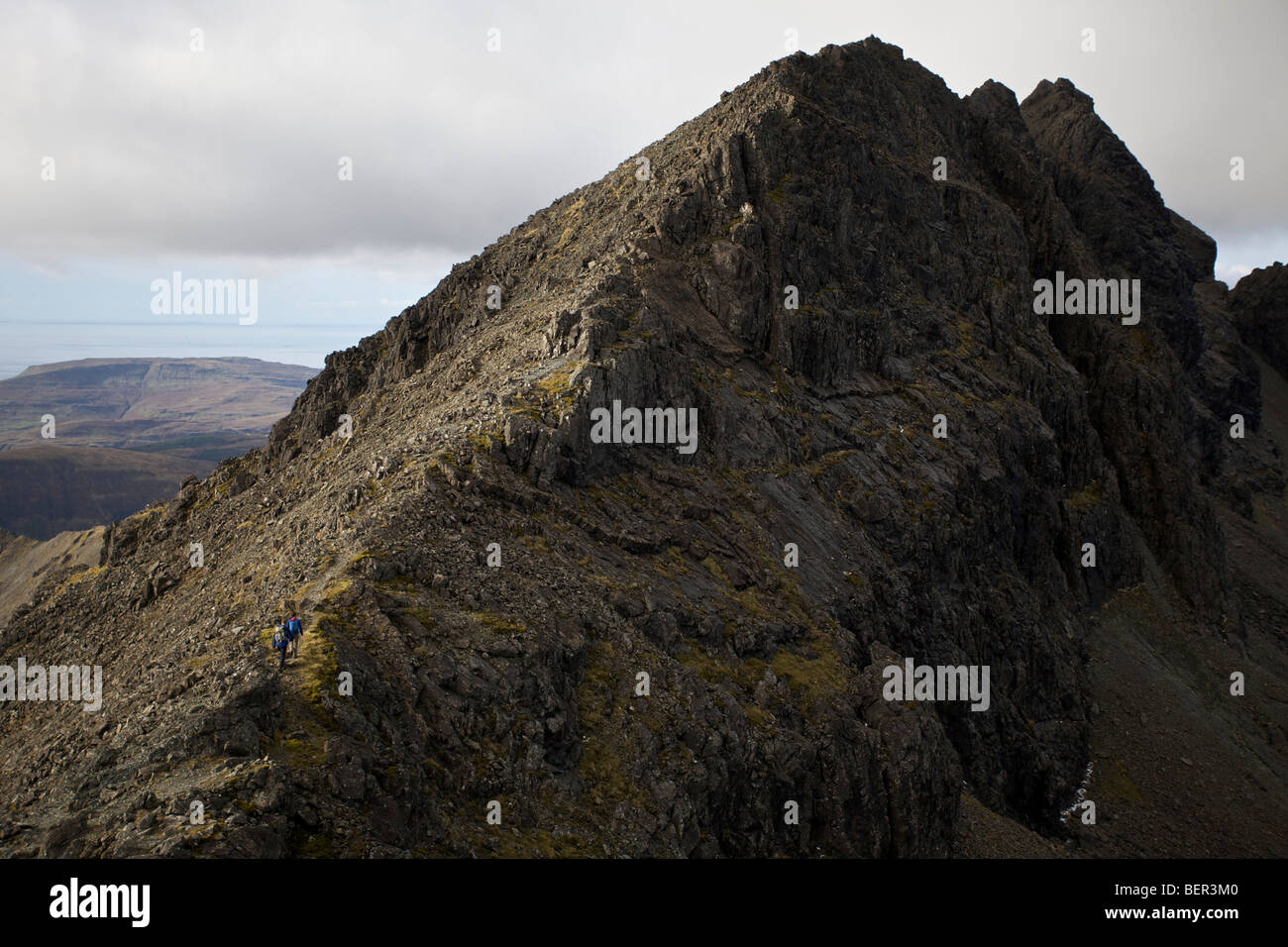 Hikers traversing the Cuillin Ridge, Isle of Skye, Scotland Stock Photo ...