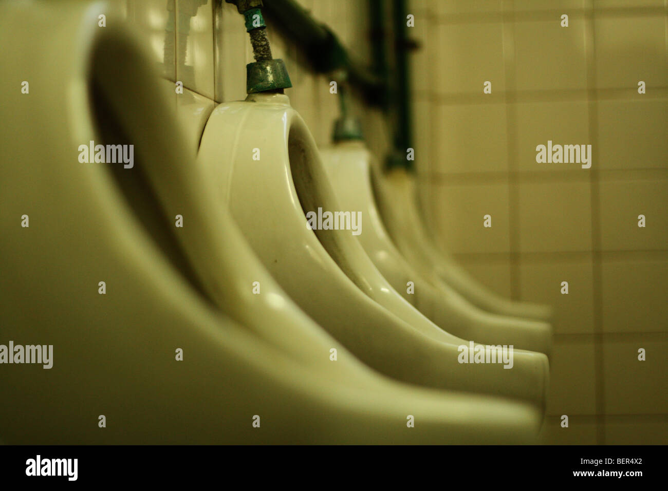A couple of urinals in a public bathroom Stock Photo - Alamy