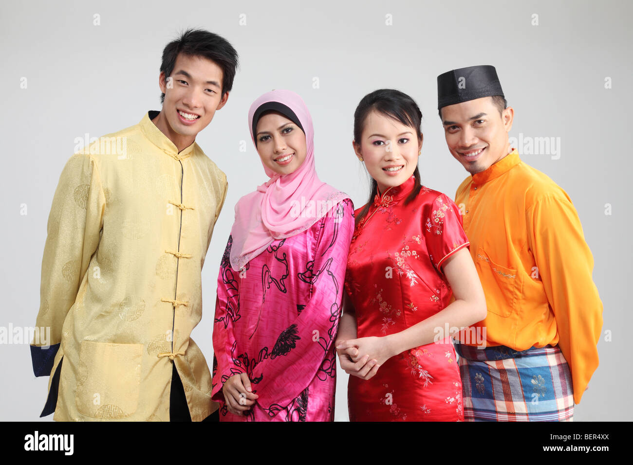 Mix culture men and women posing at camera Stock Photo - Alamy