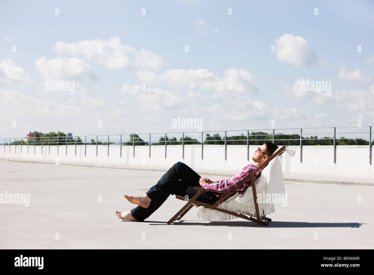 man relaxing in the sun Stock Photo - Alamy