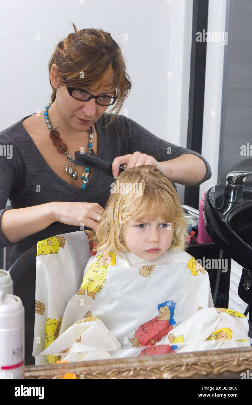 Cutting hair scissors unhappy hi-res stock photography and images - Alamy