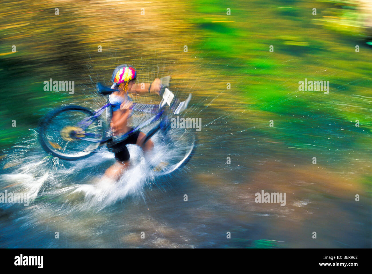 Stream woman bike splash sports hi-res stock photography and images - Alamy