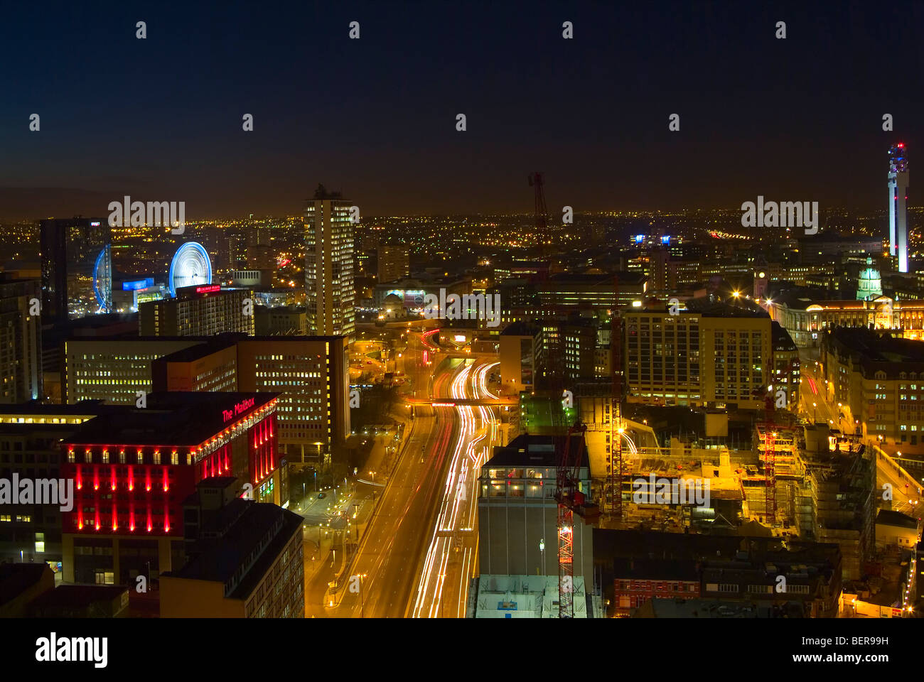 Cityscape night shot looking form high up down on high rise tower ...