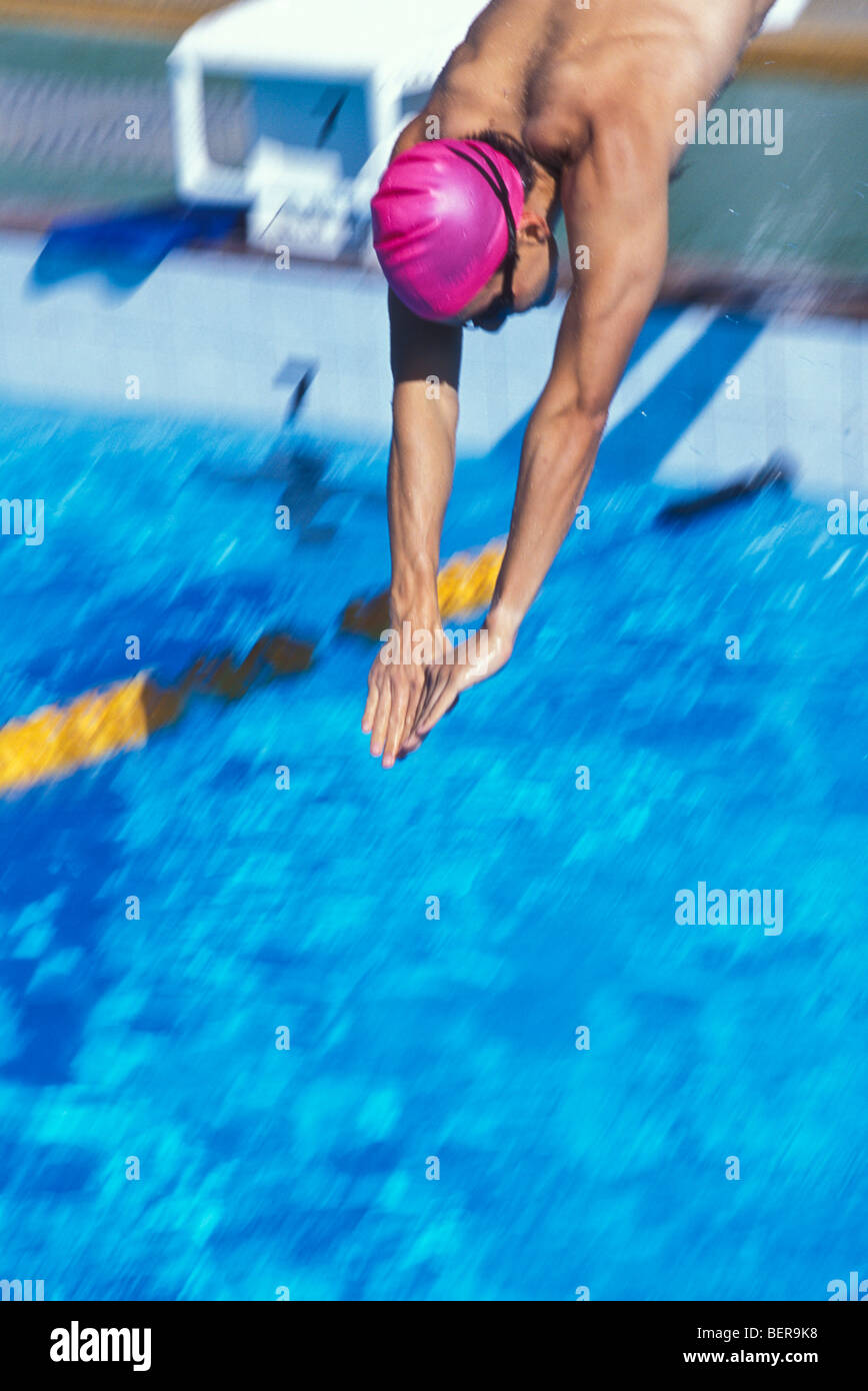 Man diving into swimming pool Stock Photo - Alamy