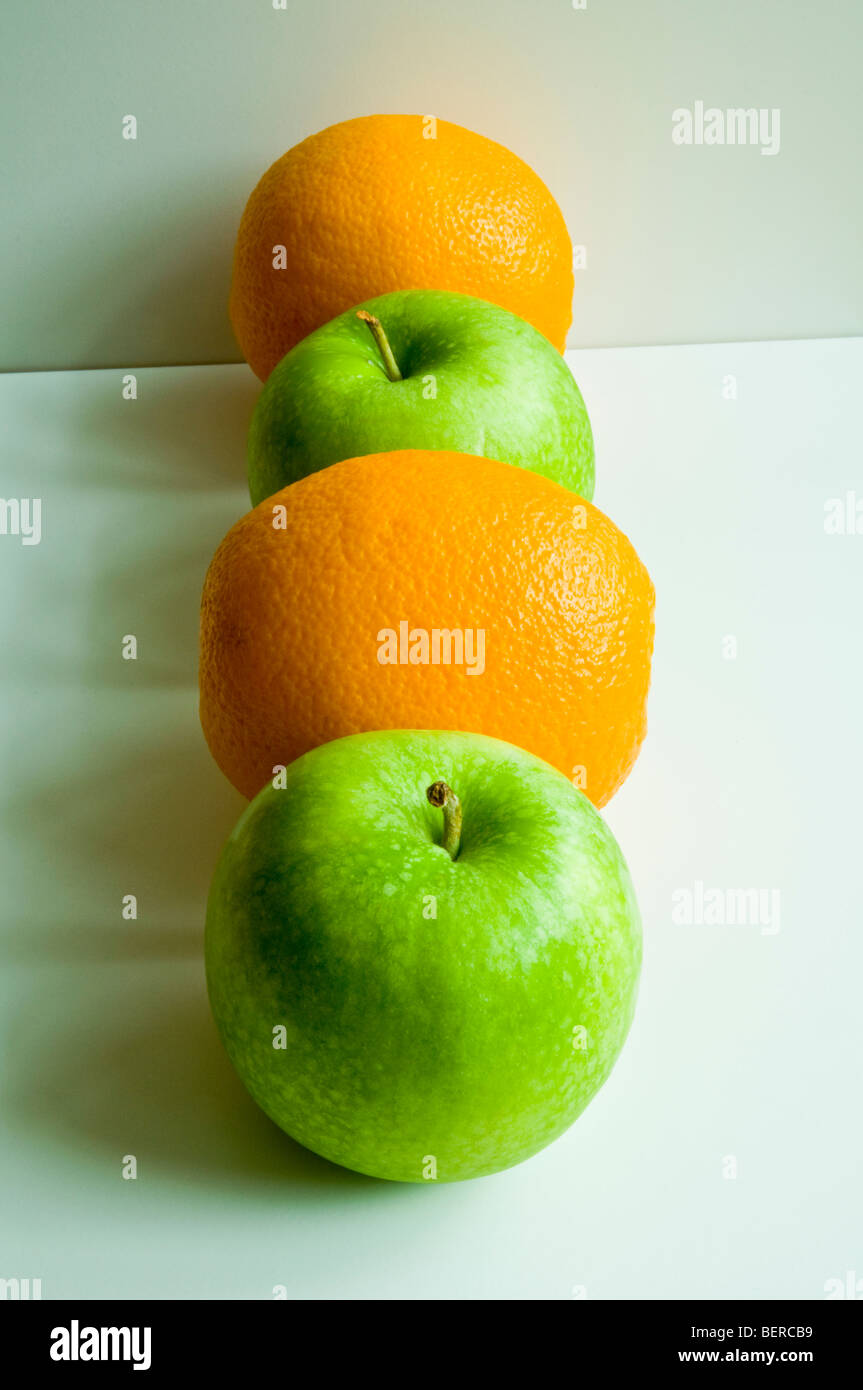 Apples and Oranges in a line Stock Photo - Alamy