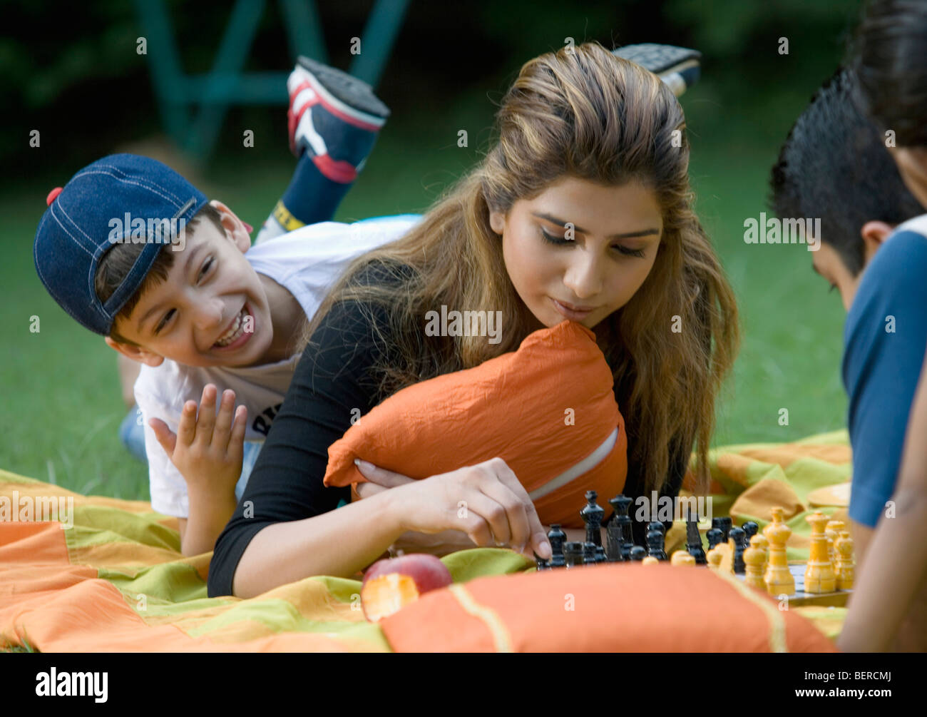 Family playing chess at picnic Stock Photo - Alamy