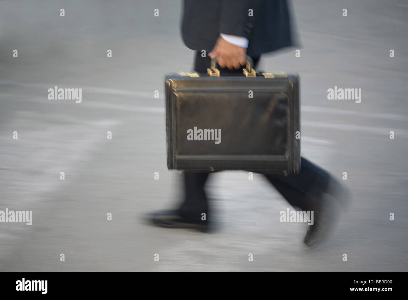 Man carrying a briefcase Stock Photo - Alamy