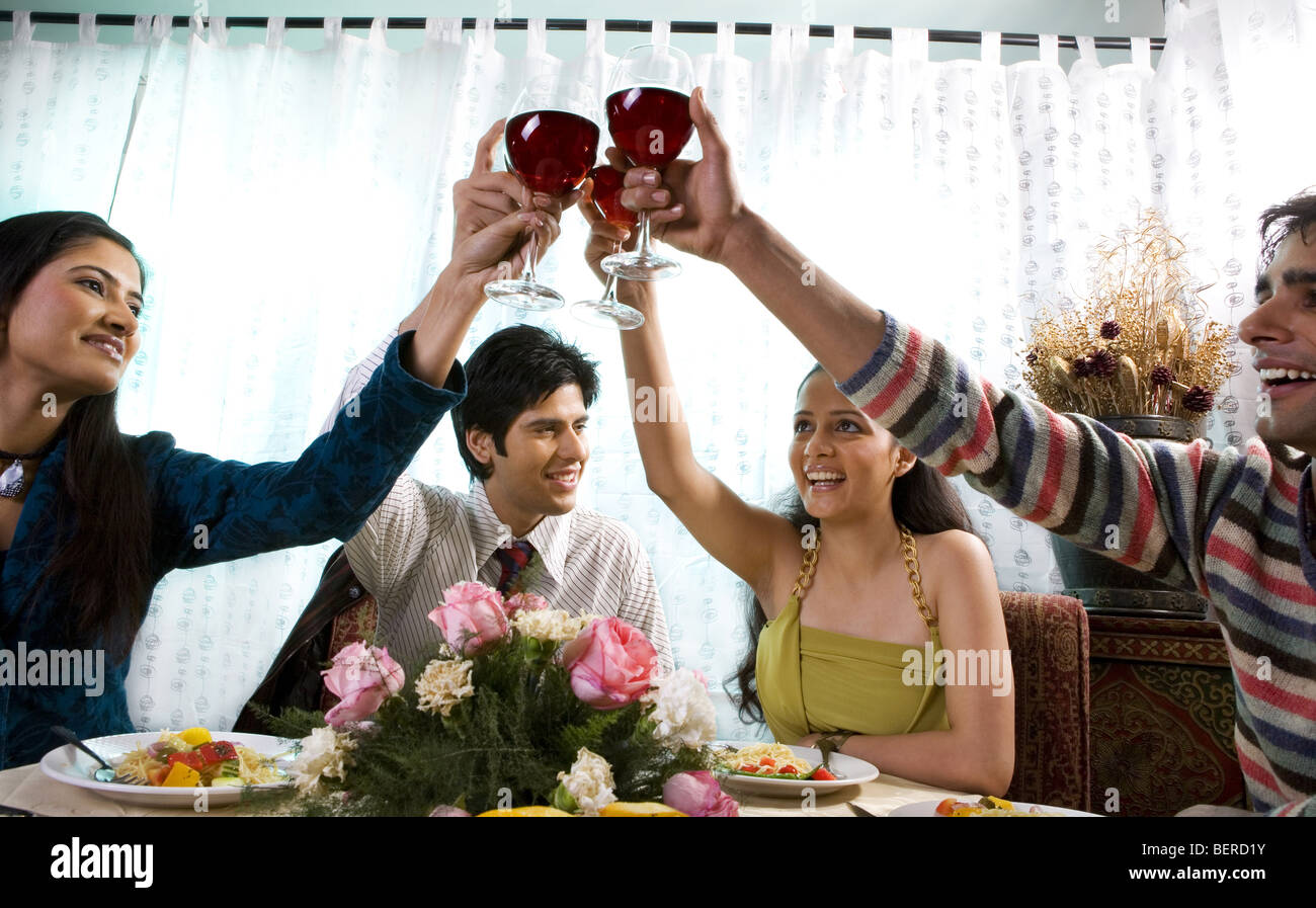 Friends celebrate together Stock Photo - Alamy