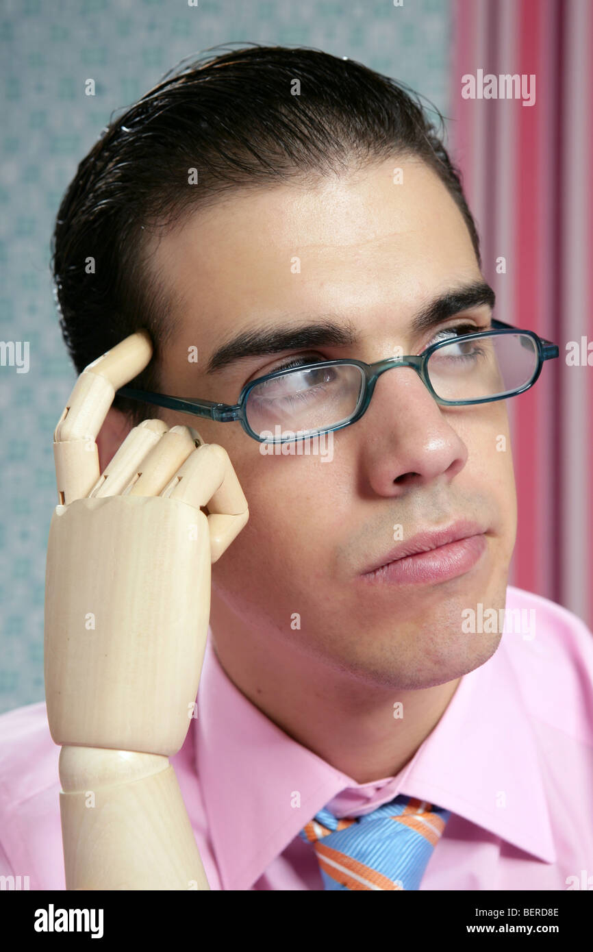 Businessman retro thinking with wooden finger over wallpaper vintage ...