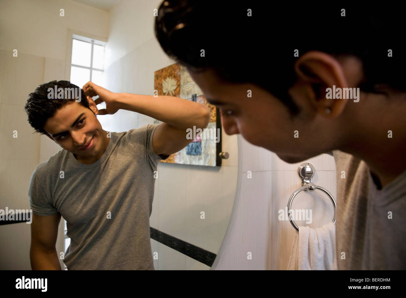Man looking in the mirror Stock Photo - Alamy