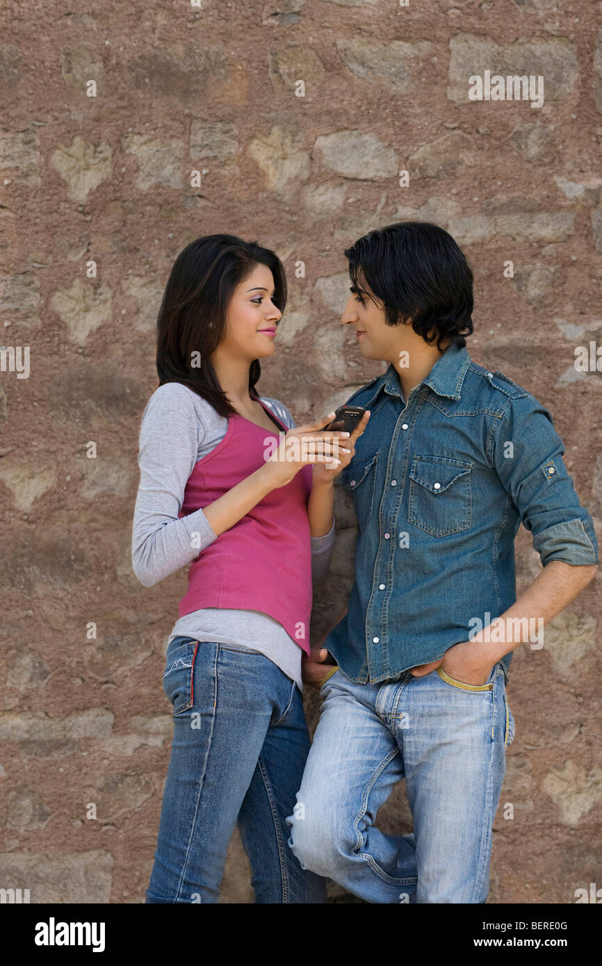 Couple standing together Stock Photo - Alamy