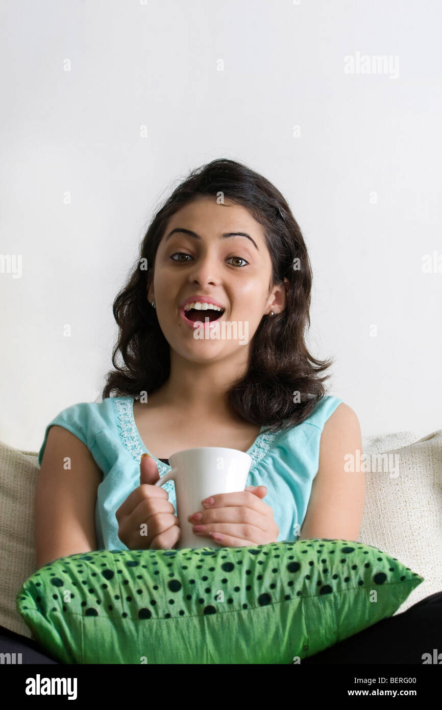 Woman drinking tea Stock Photo - Alamy