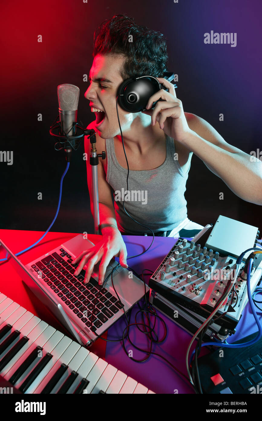Dj with colorful light and music mixing digital equipment Stock Photo ...