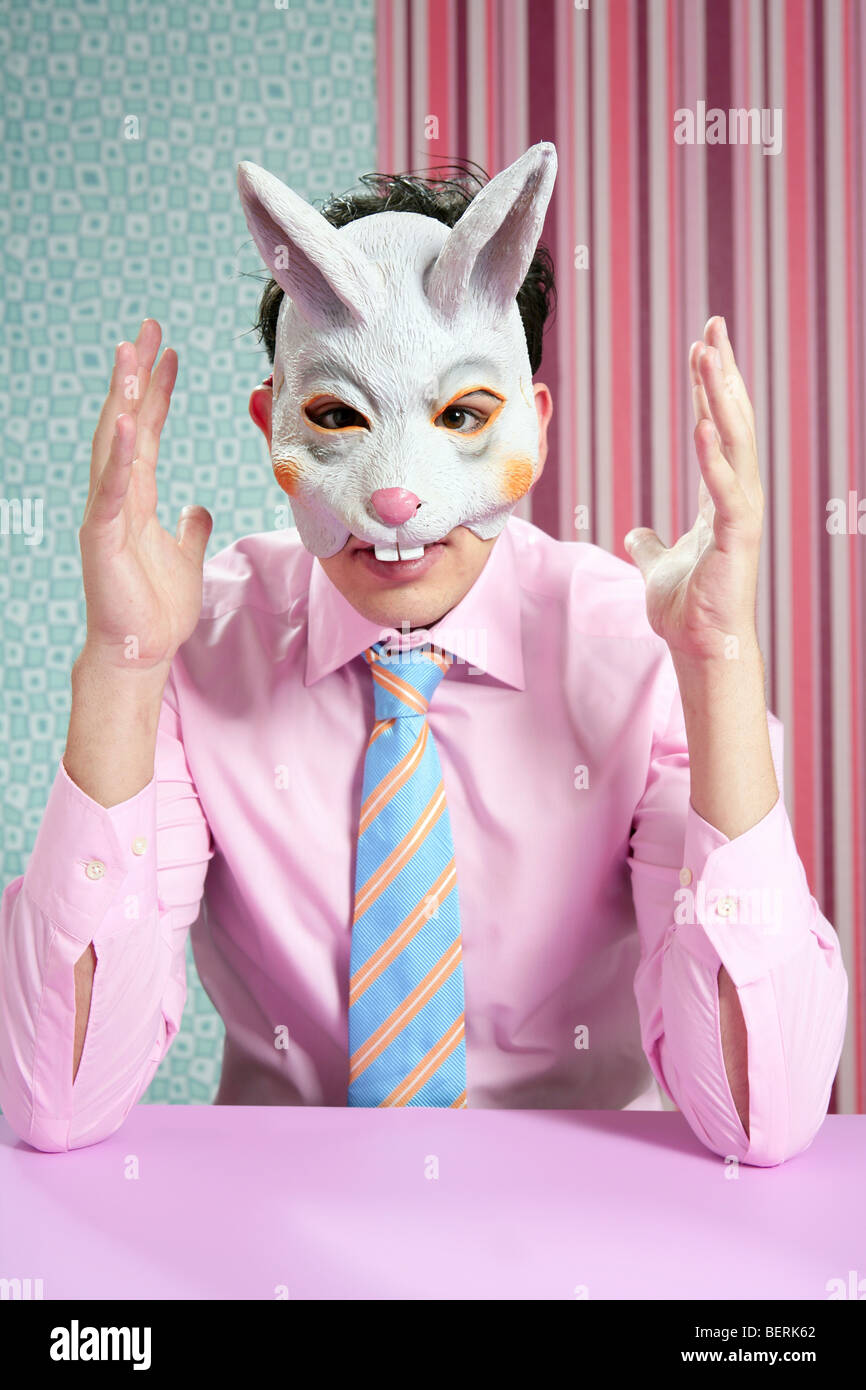 Businessman with funny rabbit mask portrait over wallpaper Stock Photo ...