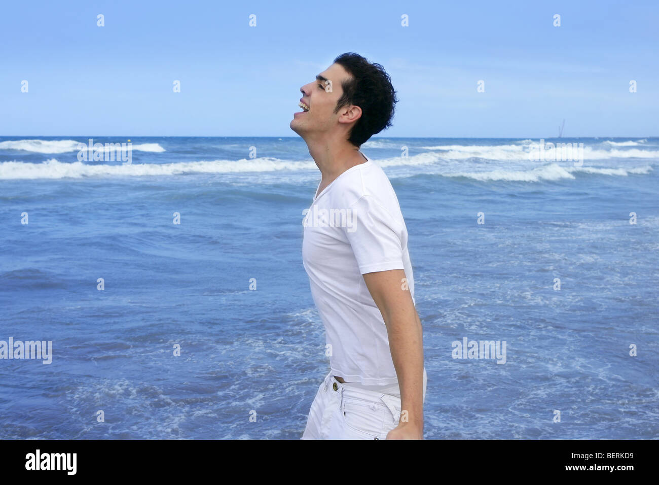 Handsome young man on the blue ocean beach summer sea Stock Photo - Alamy