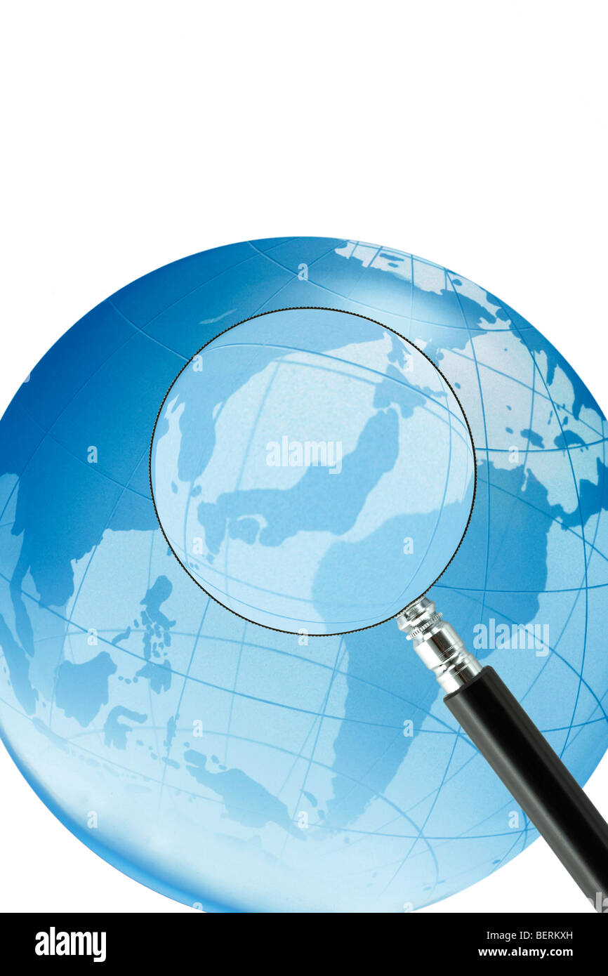 Magnifier and Globe Stock Photo - Alamy