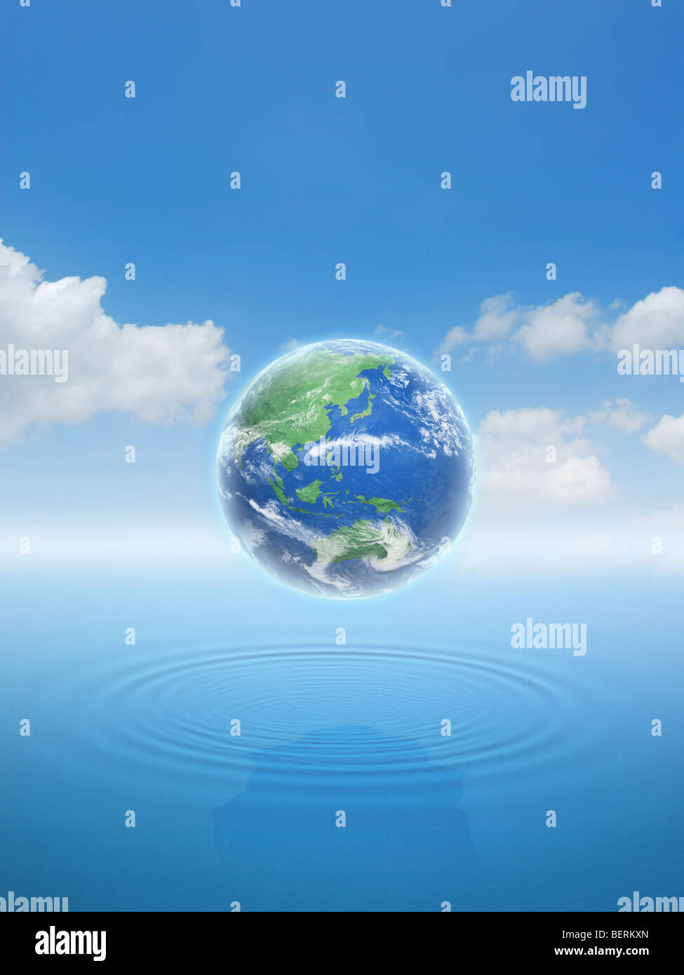 Planet earth above water Stock Photo - Alamy