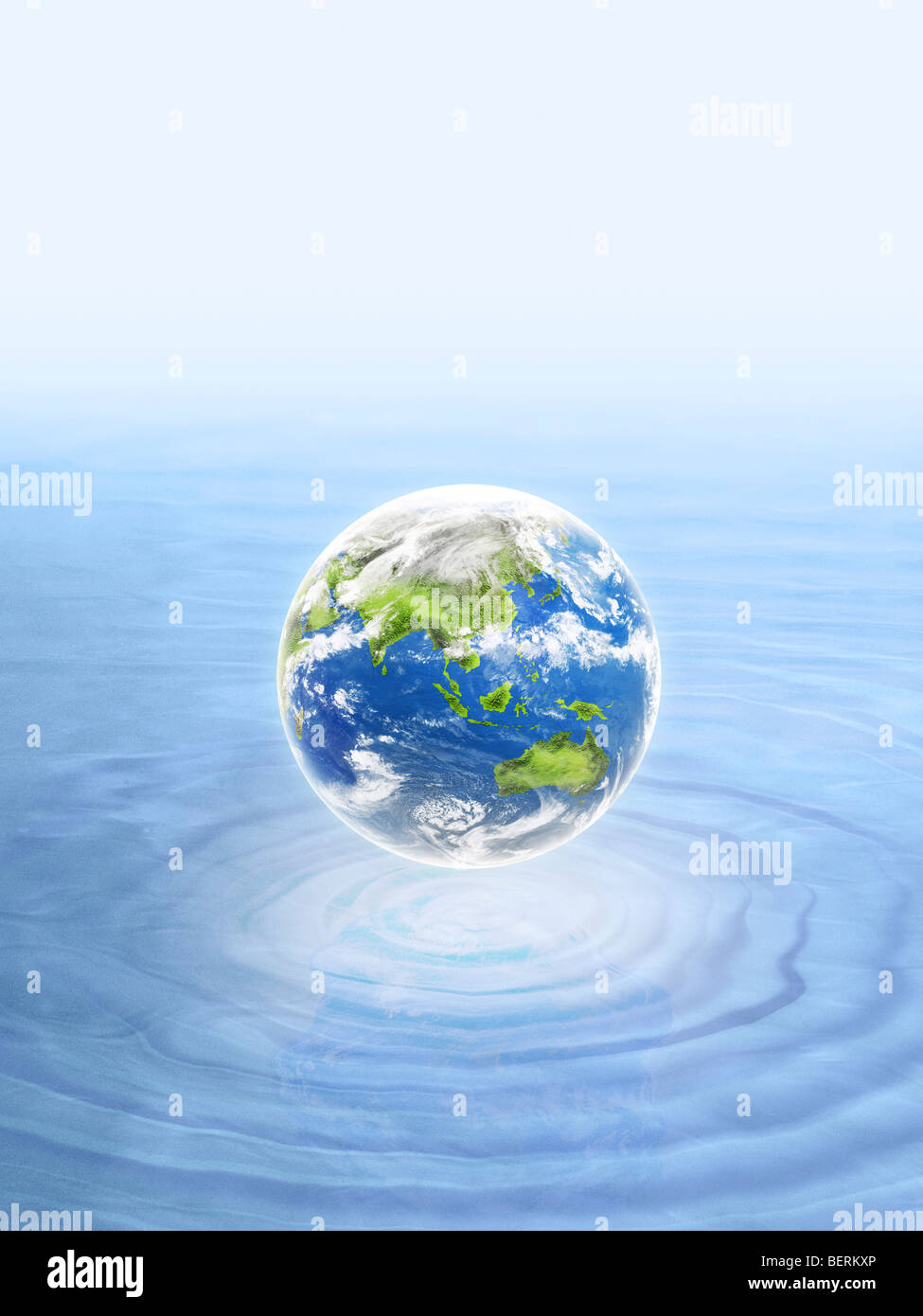 Planet earth above water Stock Photo - Alamy