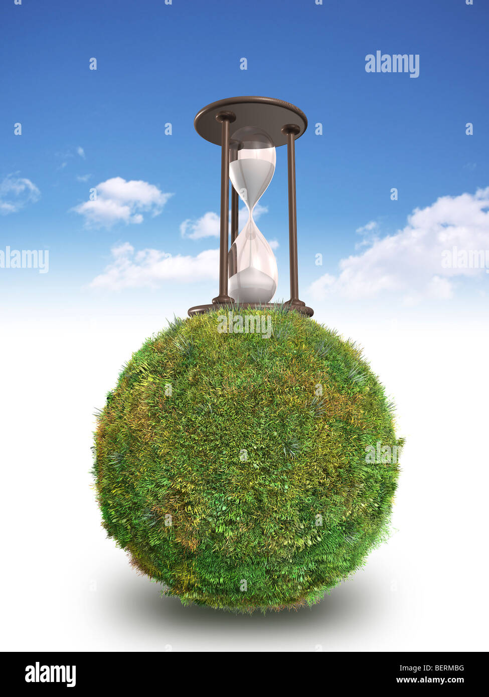 Hourglass on grass covered sphere Stock Photo - Alamy