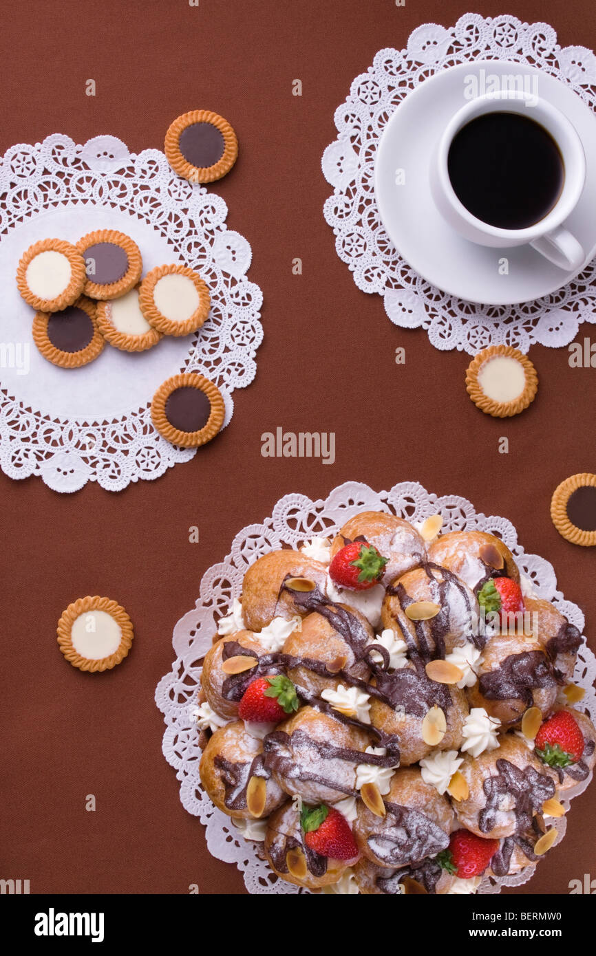 Pastries and a cup of coffee, colored background Stock Photo - Alamy