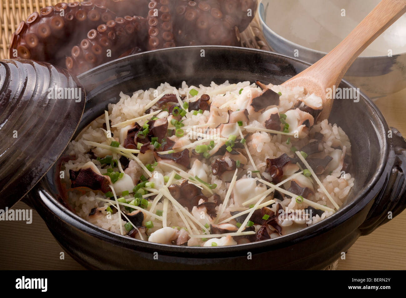 Rice cooked with slices of octopus close up Stock Photo - Alamy