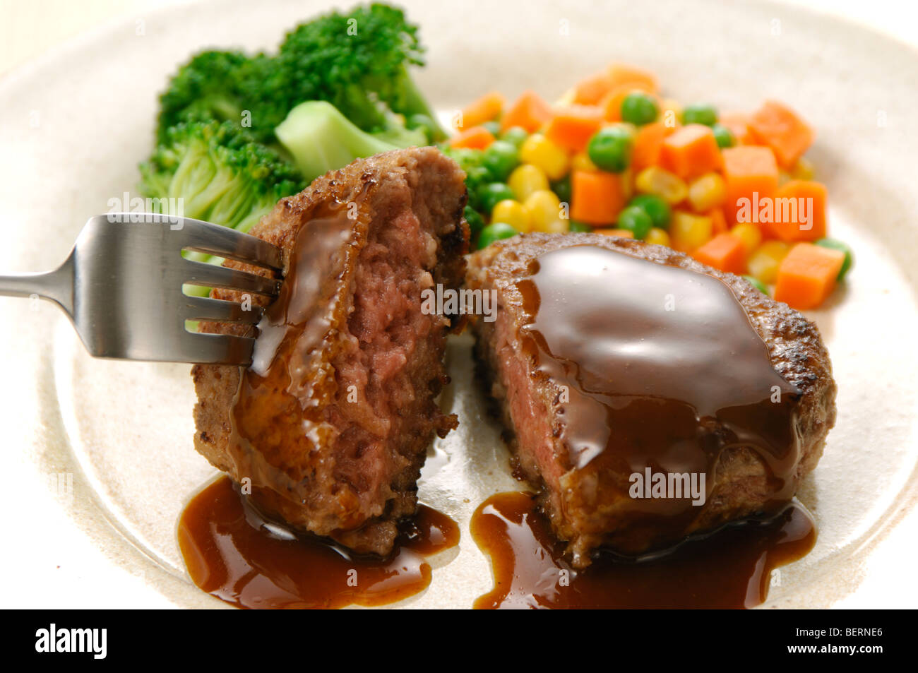 Plate of hamburger steak, close up Stock Photo - Alamy