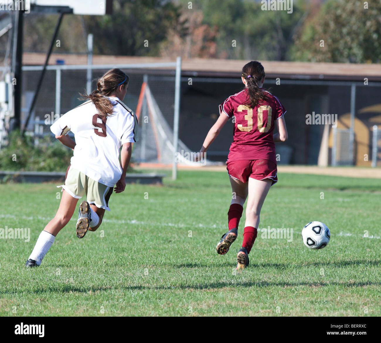 Teenage girls playing high school soccer football Stock Photo - Alamy