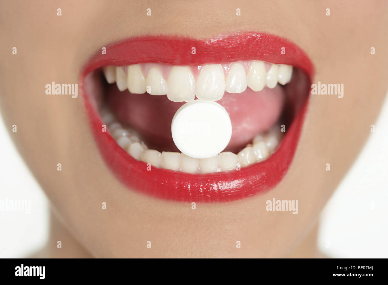 Beauty woman mouth with red lips and medicine pill Stock Photo - Alamy