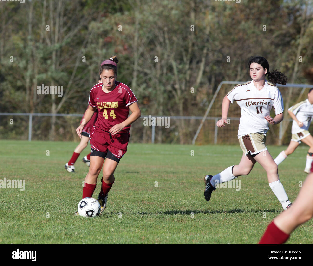 Teenage girls playing high school soccer football Stock Photo - Alamy