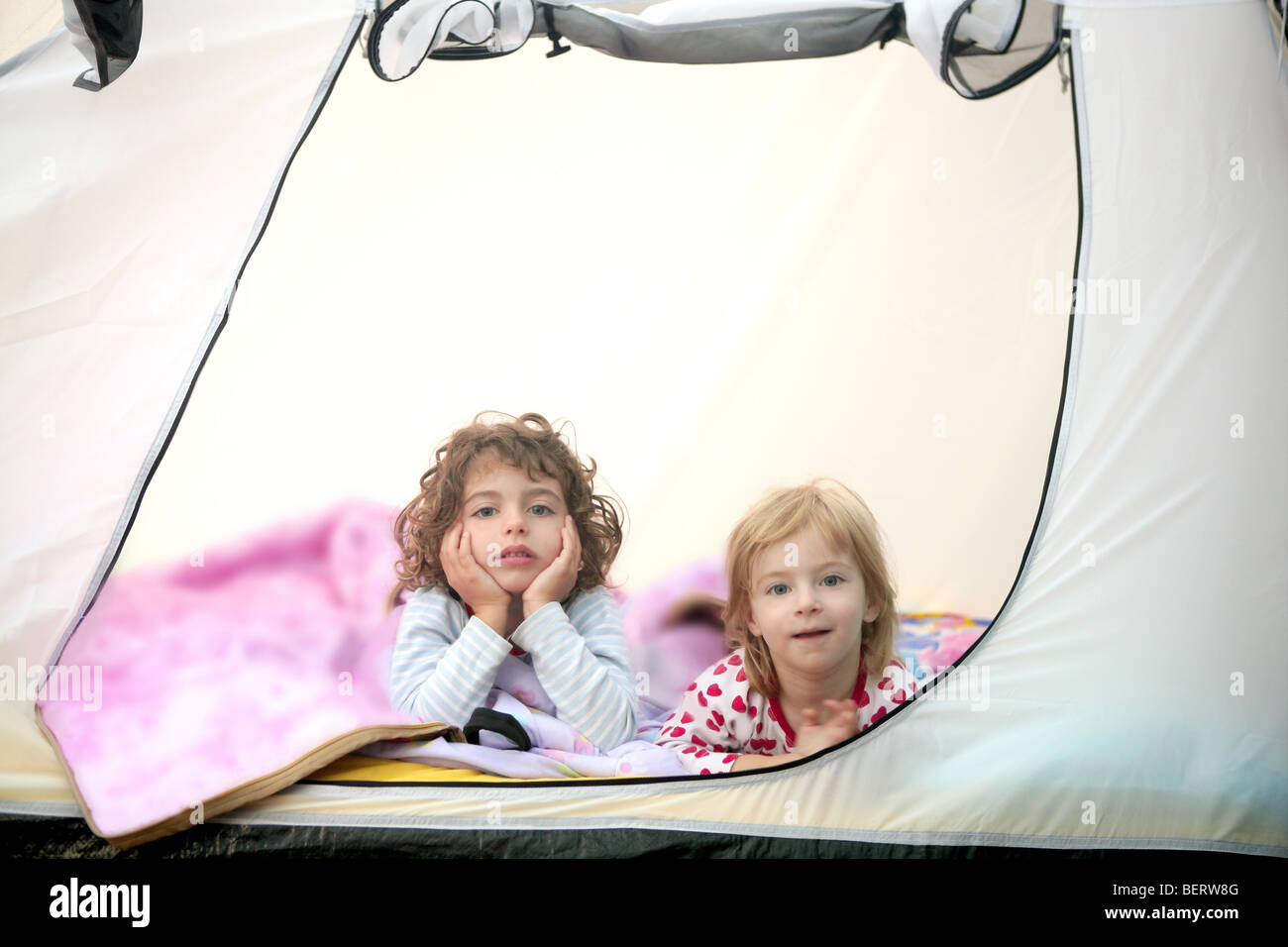 Camping tent vacation with two little beautiful girls in nature Stock ...