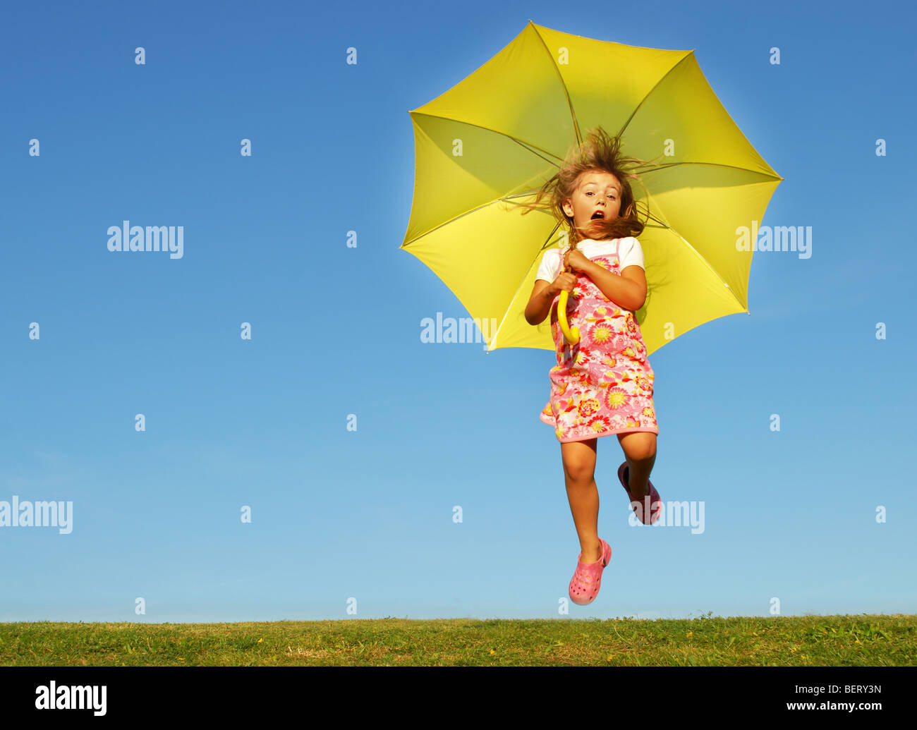 Flying with umbrella Stock Photo - Alamy